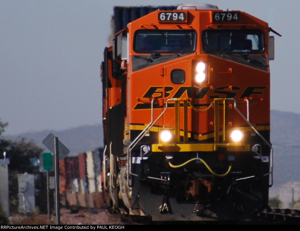 Into the cab shot of BNSF 6794 as she makes the curve just west of the BNSF Barstow Yard.
